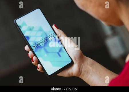 In this photo illustration, the Isomorphic Labs logo is displayed on a ...