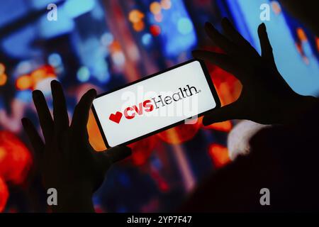 In this photo illustration, a CVS logo is seen displayed on a ...