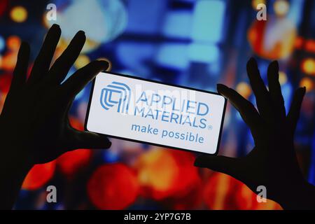 In this photo illustration an Applied Materials logo seen displayed on ...