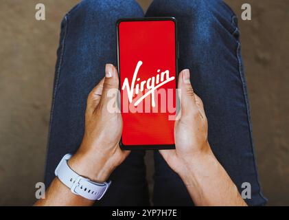 In this photo illustration, the Virgin Group logo is displayed on a ...