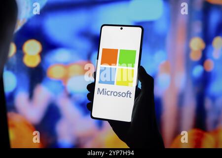 In this photo illustration, a Microsoft logo is displayed on a ...