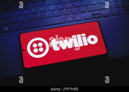 In this photo illustration, the Twilio logo is displayed on a ...