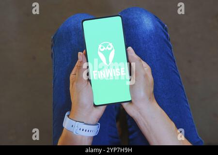 In this photo illustration, the FinWise Bank logo is displayed on a ...