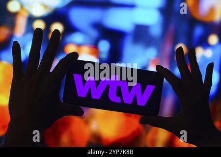 In this photo illustration, the WTW (Willis Towers Watson) logo is seen ...