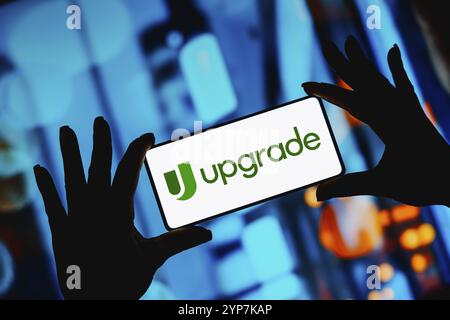 In this photo illustration, the Upgrade logo is seen displayed on a ...
