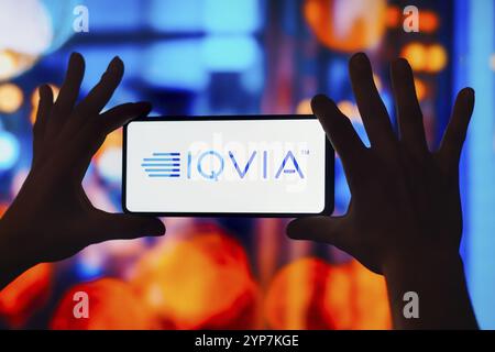 In this photo illustration, an IQVIA logo is seen displayed on a ...