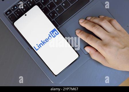 In this photo illustration a LinkedIn logo seen displayed on a ...