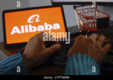 In this photo illustration, the Alibaba company logo is seen displayed ...