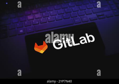 In this photo illustration, the GitLab logo is displayed on a ...