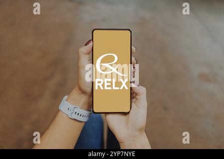 In this photo illustration, the RELX Group logo is displayed on a ...