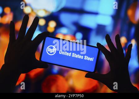 In this photo illustration, the logo of US steel company Nucor ...