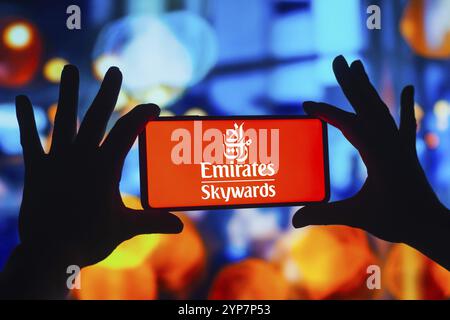 In this photo illustration an Emirates airlines logo seen displayed on ...