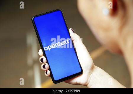 In this photo illustration, the OpenText Corporation logo is displayed ...