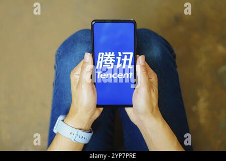 In this photo illustration, a Tencent logo is seen displayed on a ...
