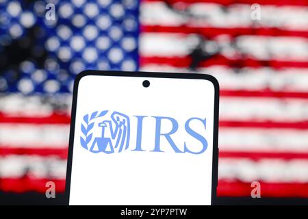In this photo illustration, the Internal Revenue Service (IRS) logo is ...