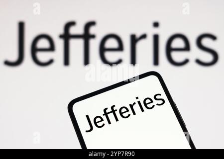 In this photo illustration the Jefferies Group logo seen displayed on a ...