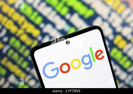In this photo illustration a Google logo seen displayed on a smartphone ...