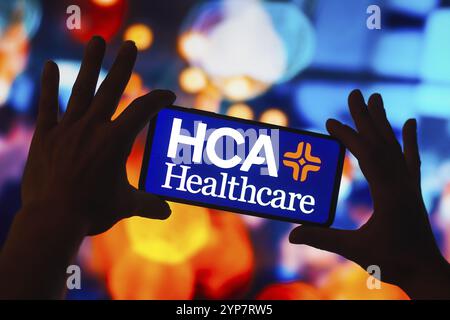In this photo illustration, a HCA Healthcare logo is seen displayed on ...