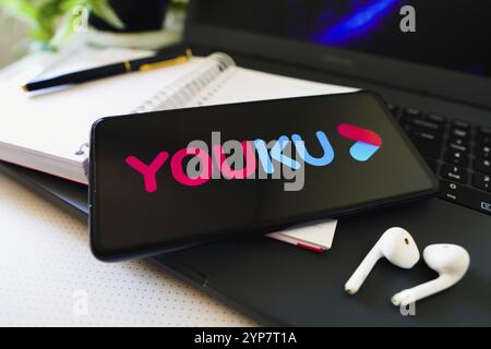 In this photo illustration, the Youku logo is displayed on a smartphone ...