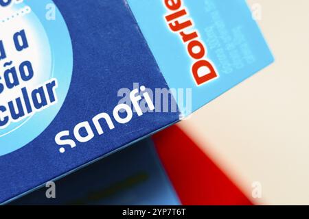 In this photo illustration, a Sanofi logo is seen on a screen and a ...