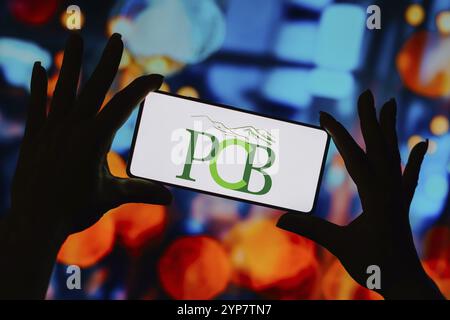 In this photo illustration, the Pendleton Community Bank (PCB) logo is ...