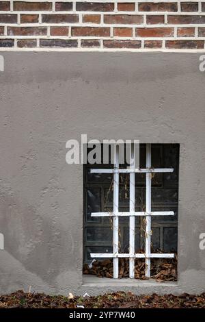 barred basement window in an old apartment building Stock Photo - Alamy