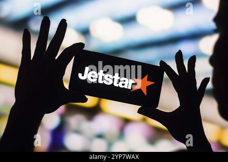 In this photo illustration, the Jetstar Airways logo is displayed on a ...
