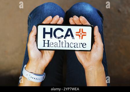 In this photo illustration, a HCA Healthcare logo is seen displayed on ...