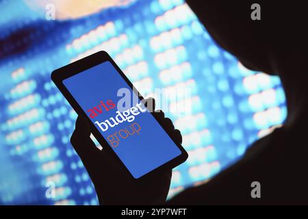 In this photo illustration, the Avis Budget Group logo is displayed on ...