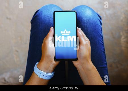 In this photo illustration a Royal Dutch Shell logo seen displayed on a ...