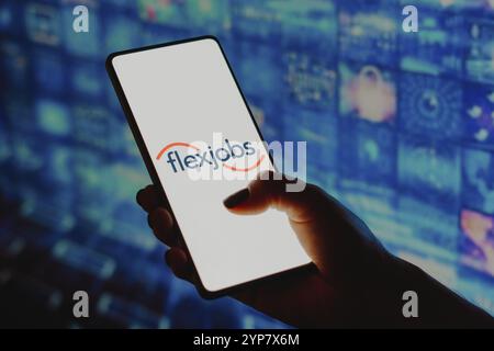 In this photo illustration, the FlexJobs logo is displayed on a ...
