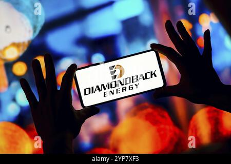 In this photo illustration, the Diamondback Energy logo is seen ...