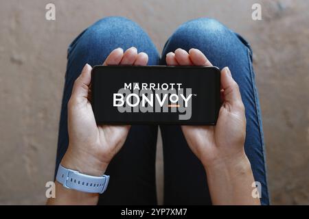 In this photo illustration, the Marriott Bonvoy logo is displayed on a ...