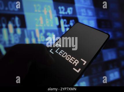In this photo illustration, the Ledger logo is displayed on a ...