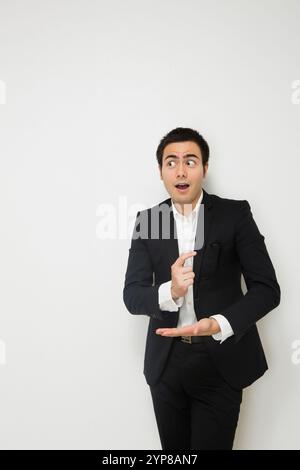 Businessman in an inspirational pose Stock Photo - Alamy