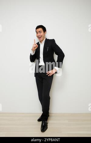 Businessman in an inspirational pose Stock Photo - Alamy