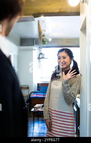 Wife seeing someone off Stock Photo - Alamy