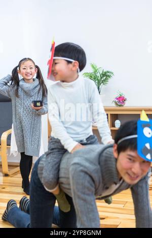 Family members throwing beans on Setsubun Stock Photo - Alamy
