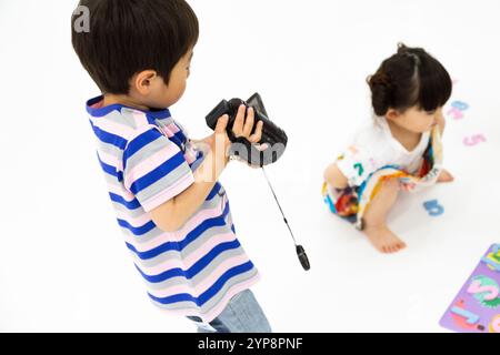 Boy rolling video camera Stock Photo - Alamy