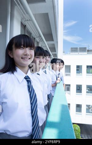 Secondary school children lined up on balcony Stock Photo - Alamy