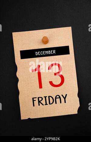 Calendar Friday the 13th December 2024 and push pin on black color ...