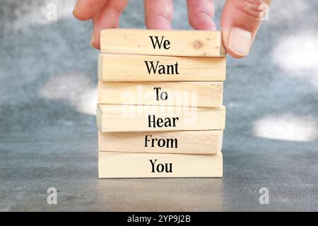 We hear and want symbol. Concept words We hear we want on wooden cubes ...