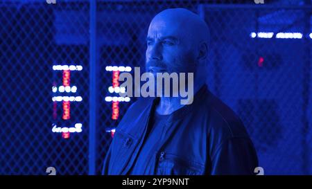 JOHN TRAVOLTA in CASH OUT (2024), directed by DOUG RICHARDSON and DIPO ...