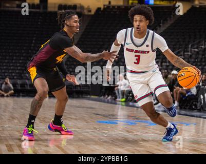 New Mexico guard Tru Washington dribbles around UNLV's Jeremiah Cherry ...