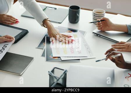 Business team hands collaborating on UI UX design creative process with ...