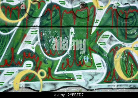 Bright, colorful lettering with green letters and black, yellow, red ...