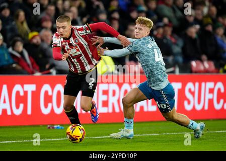 Sheffield United's Alfie Gilchrist (left) and Swansea City's Ronald ...
