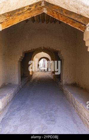 Narrow passageway in the largest preserved mud town in Oman, Al Bilaad ...