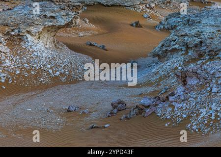 Striking cliffs surrounded by windswept sand structures, Huqf stone ...