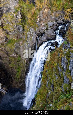 Voringfossen waterfall, Eidfjord,Norway, visitors walk across the ...